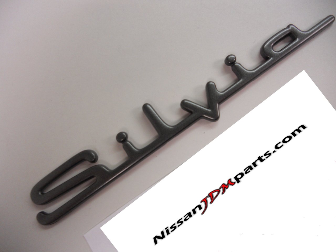 NISSAN S14 SILVIA REAR EMBLEM 84895-65F60 - nissanJDMparts.com